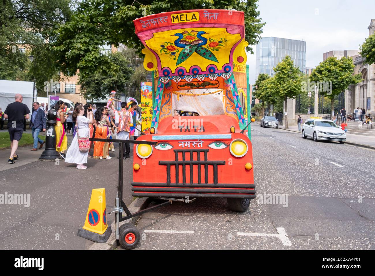 Belfast Mela Carnival Parade - brightly coloured red yellow and orange ...