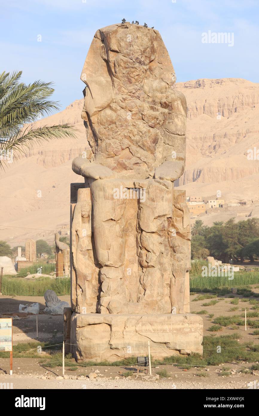 Famous Colossi of Memnon. Massive ruined statues colossi of the Pharaoh ...