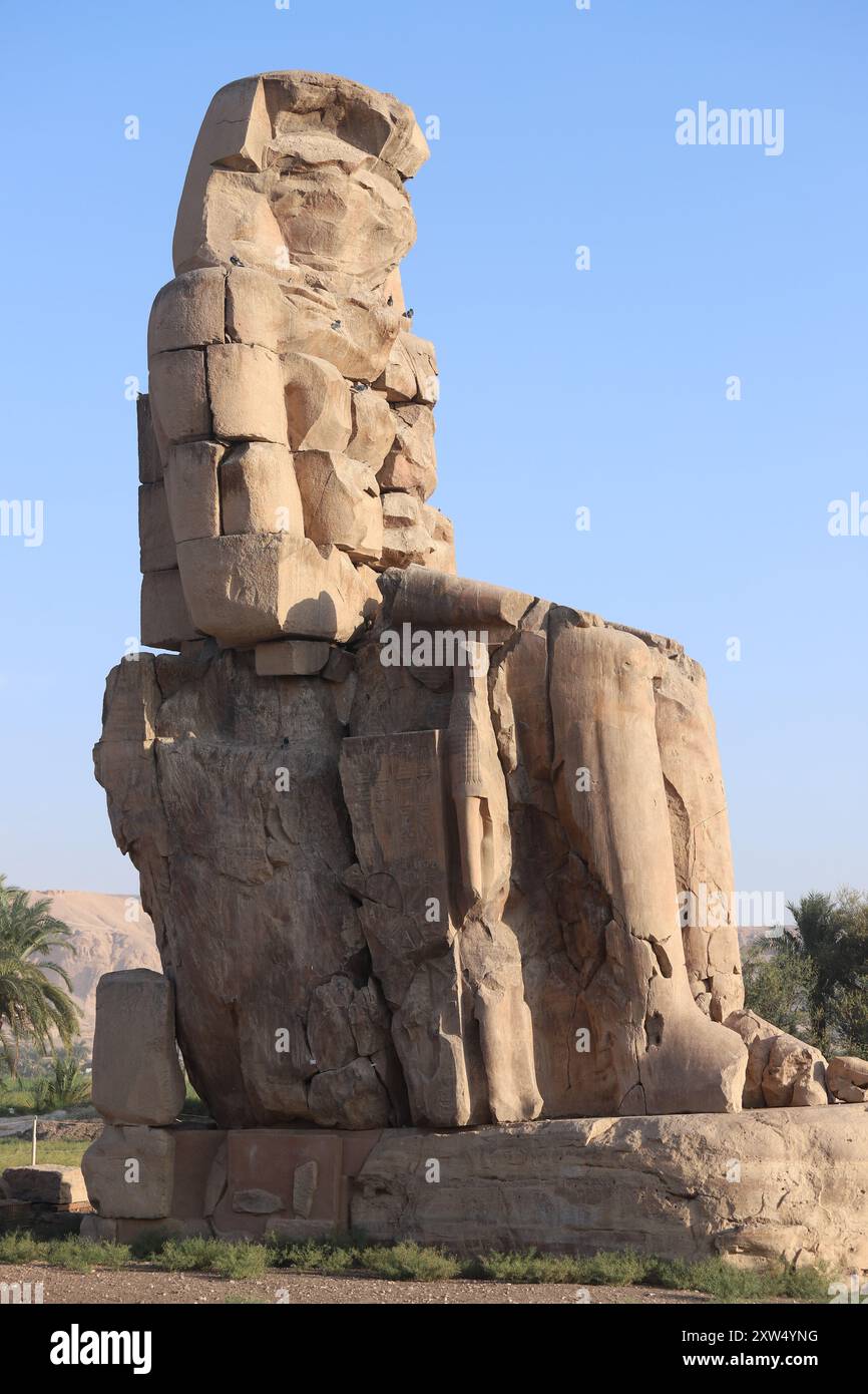 Famous Colossi of Memnon. Massive ruined statues colossi of the Pharaoh ...