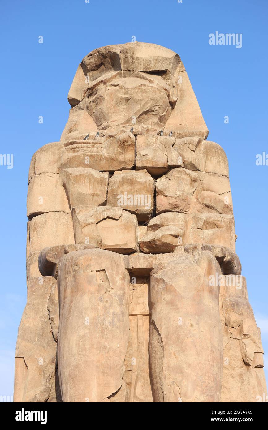 Famous Colossi of Memnon. Massive ruined statues colossi of the Pharaoh ...