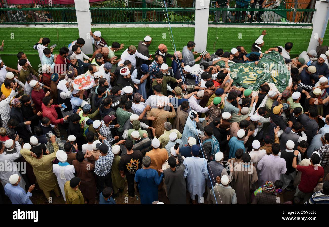 Srinagar, India. 17th Aug, 2024. Devotees carrying a cloth known as a chadar and flowers are ...