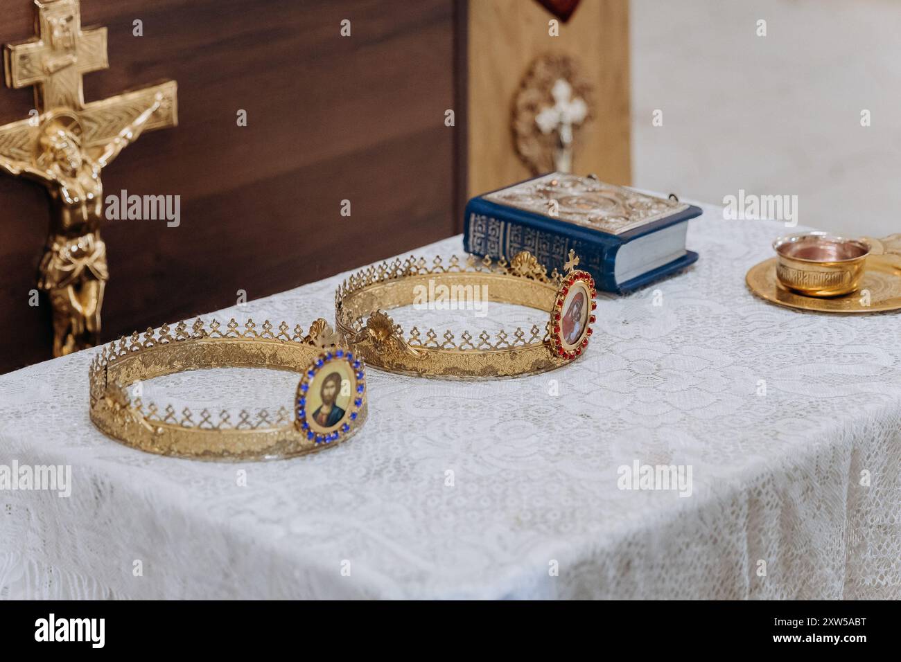 Orthodox wedding crowns and religious symbols set on altar for sacred ...