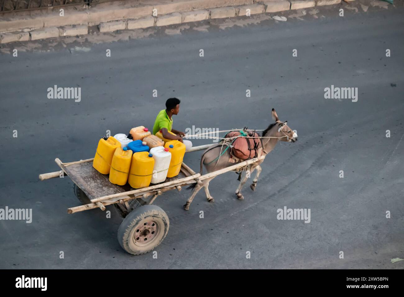 In rural Africa, a young man runs a business distributing water in ...