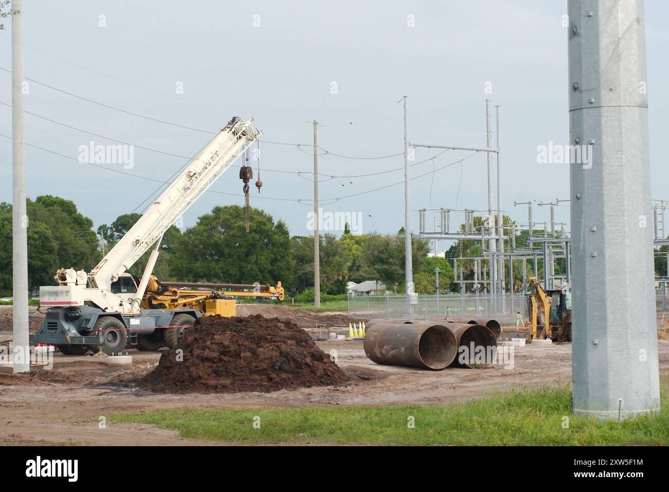Wide view dirt pile on left to construction equipment Electric ...