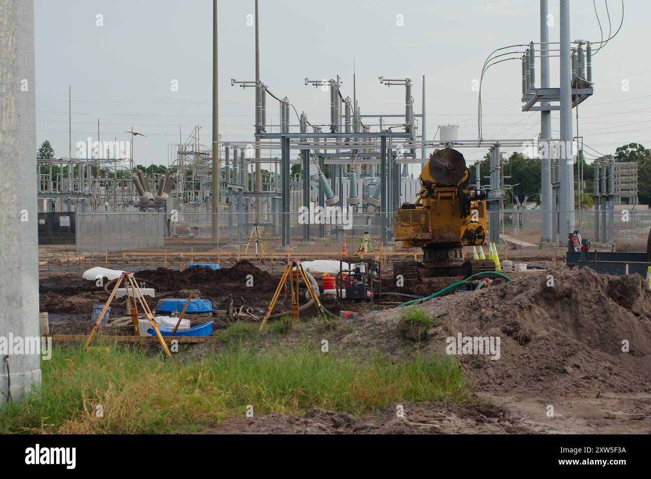 Wide view dirt pile on left to construction equipment Electric ...