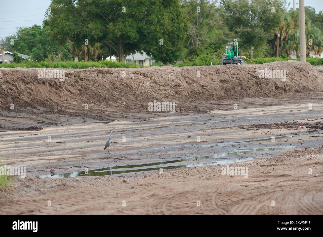 Wide view dirt pile on left to construction equipment Electric ...