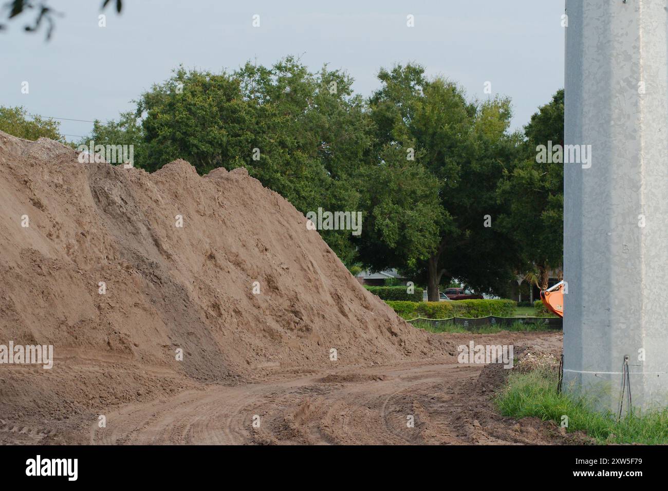 Wide view dirt pile on left to construction equipment Electric ...