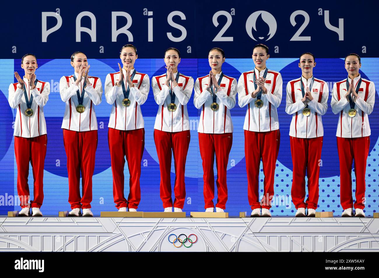 Athletes of team China celebrate after competes in the artistic ...