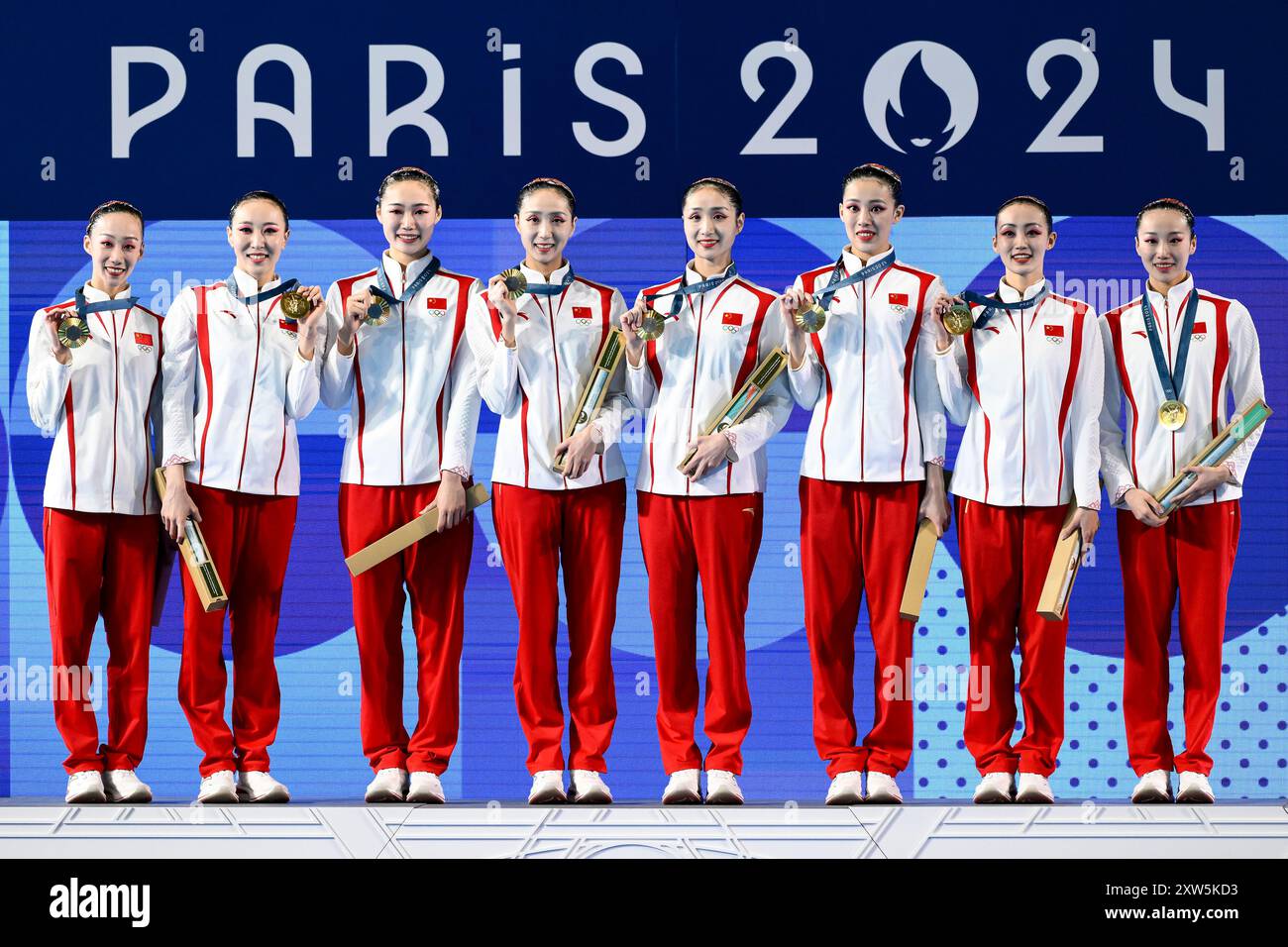 Athletes of team China celebrate after competes in the artistic ...