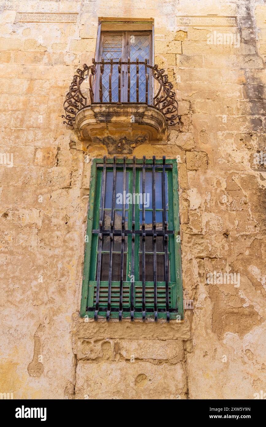 Malta, Mdina. Windows with wrought iron guards in a stone wall Stock Photo - Alamy