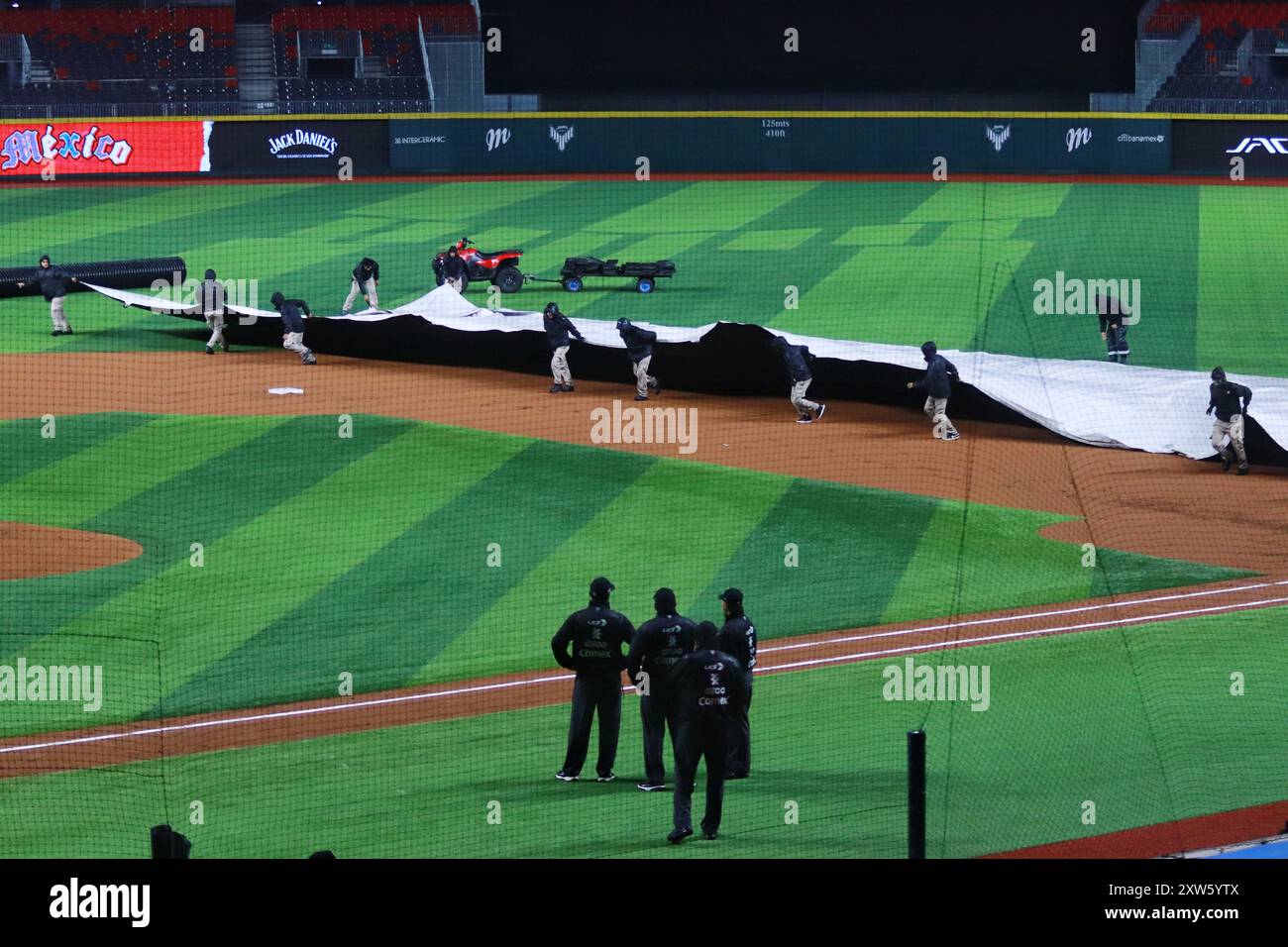 Mexico City, Mexico. 16th Aug, 2024. Maintenance crew cover the field ...