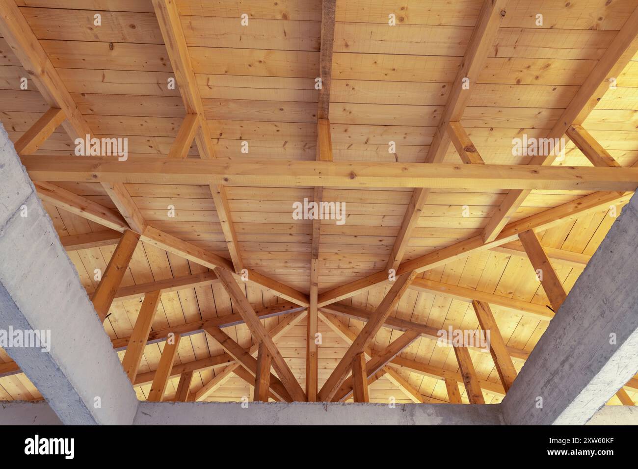 Wooden roof ceiling detail. Interior view of a wooden roof structure ...
