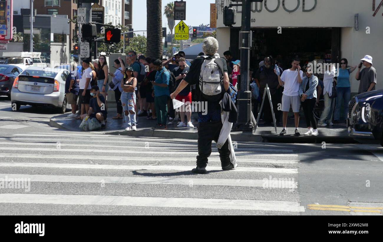 Los Angeles, California, USA 14th August 2024 Homeless Man jaywalking ...