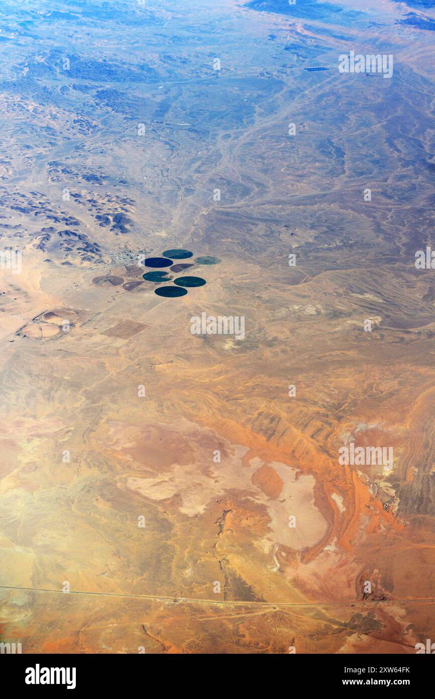 Aerial view of circular agriculture fields in the Arabian desert in ...