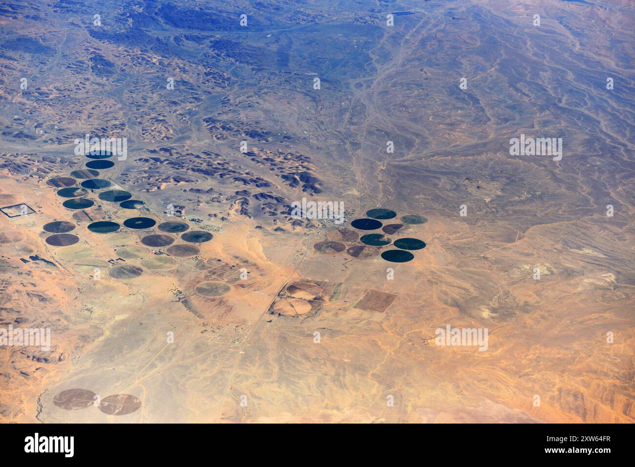 Aerial view of circular agriculture fields in the Arabian desert in ...