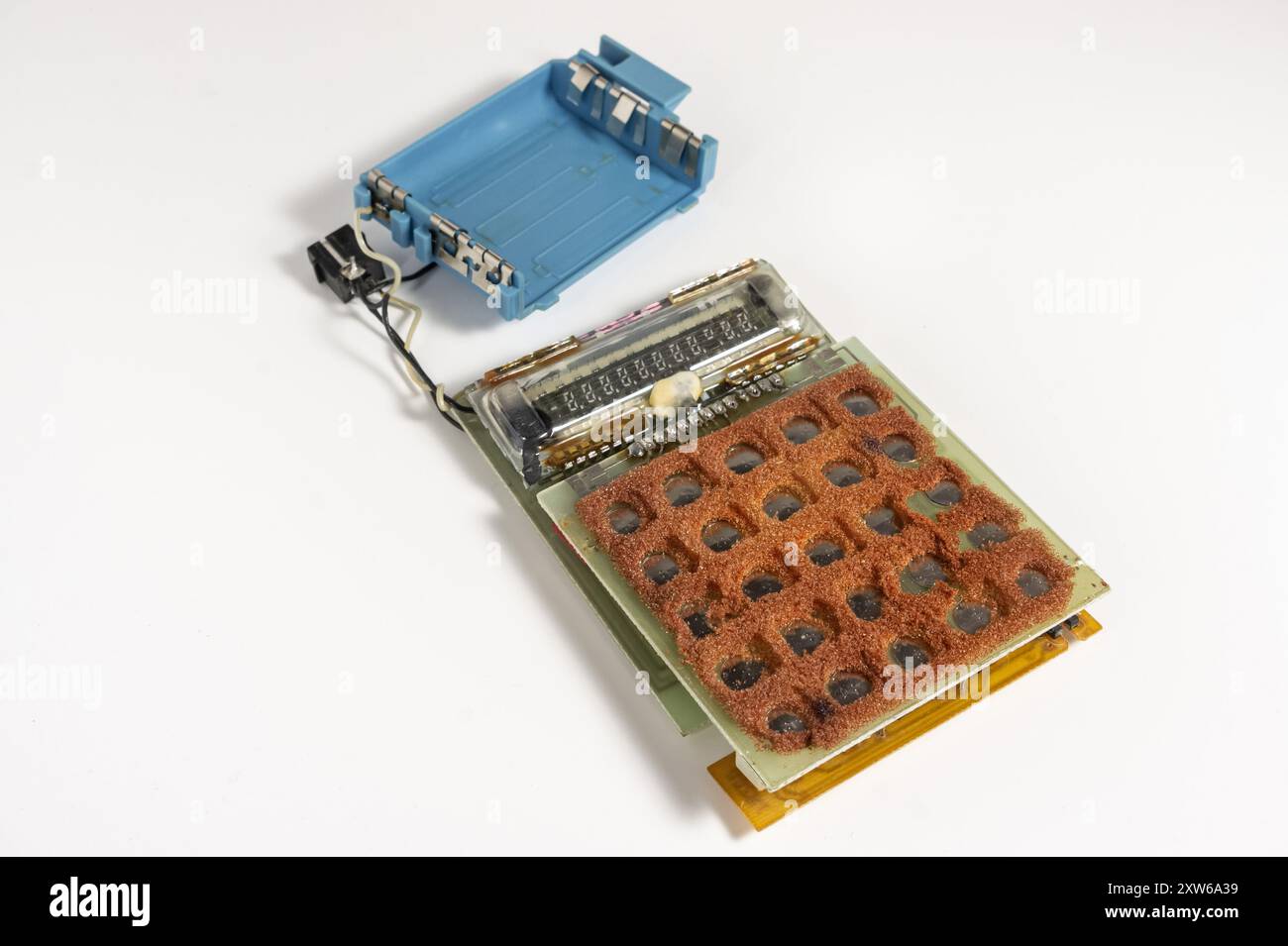 a disassembled vintage calculator with its components laid out on a ...