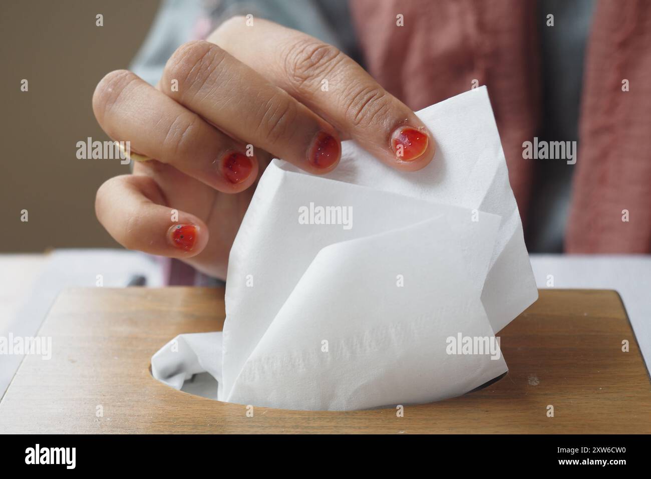 Pulling a tissue from a box hi-res stock photography and images - Alamy