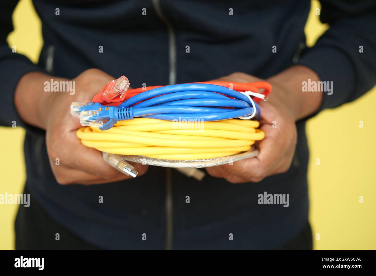 Closeup hands holding coiled blue hi-res stock photography and images ...