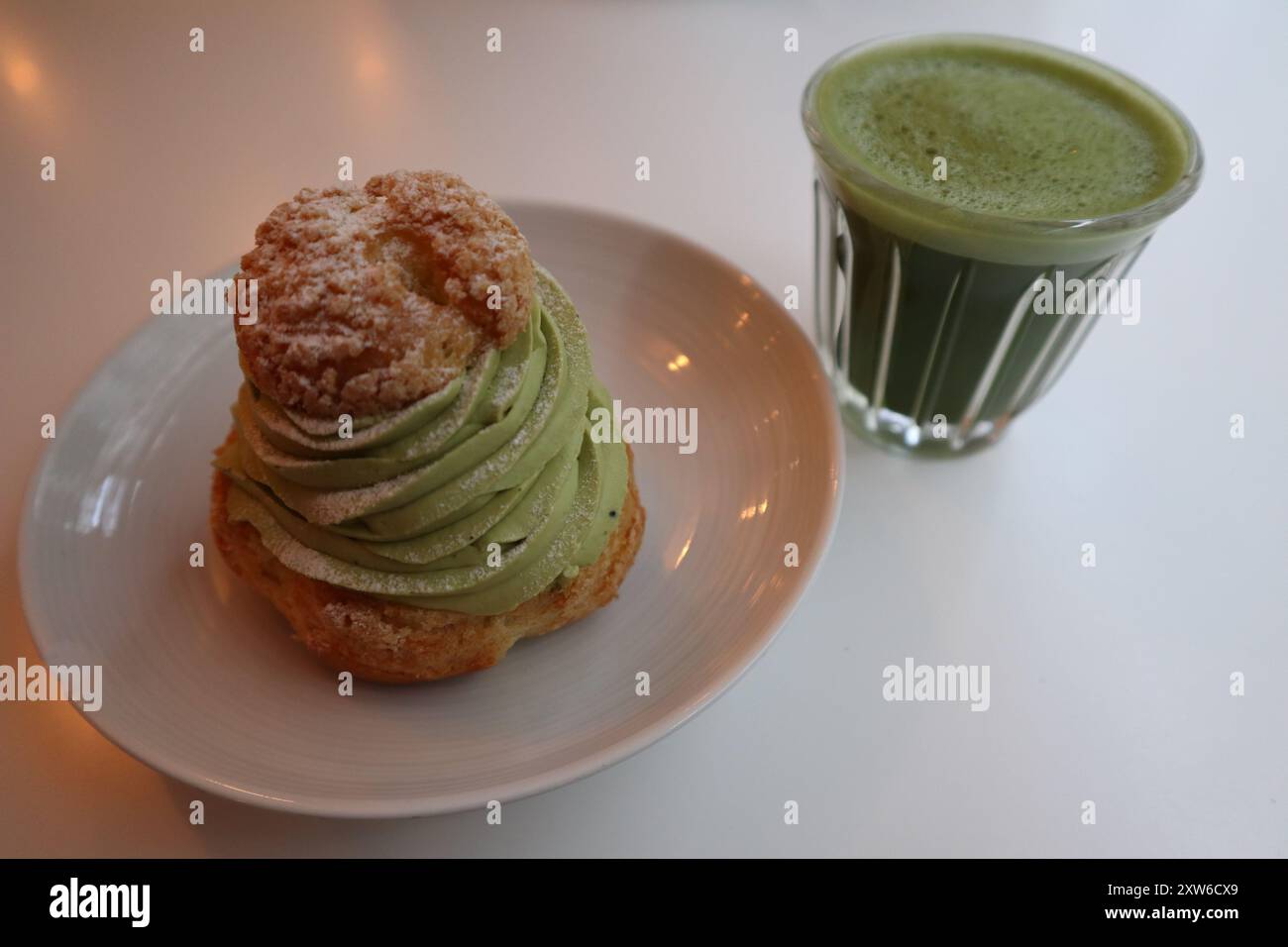 Matcha cream puff and hot matcha tea in Paris, France Stock Photo - Alamy