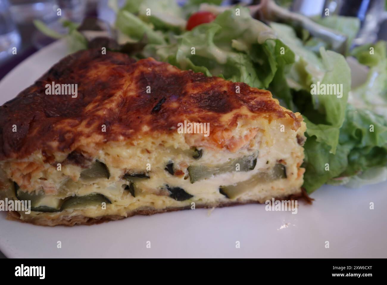 French cuisine: salmon and zucchini quiche in Paris, France Stock Photo ...
