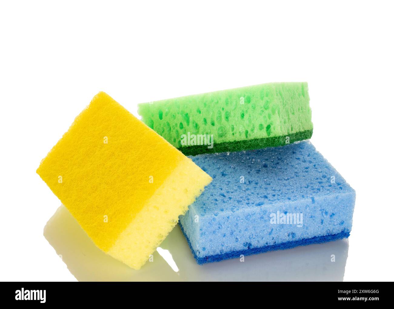 Three kitchen sponges, macro, isolated on white background Stock Photo ...