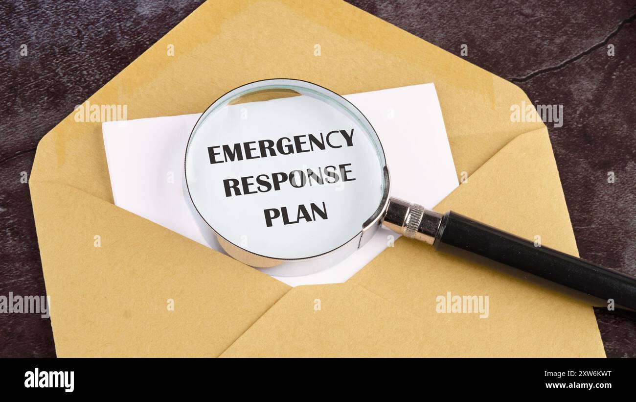 ERP as EMERGENCY RESPONSE PLAN written through a magnifying glass in a letter on white paper ...