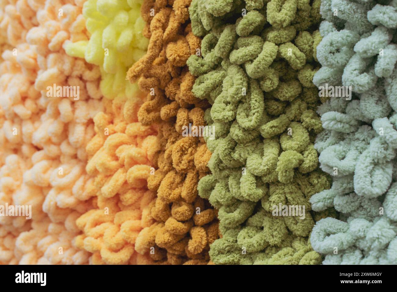 Fluffy plush yarn in storage. Colourful puffy yarn background. Knitting ...