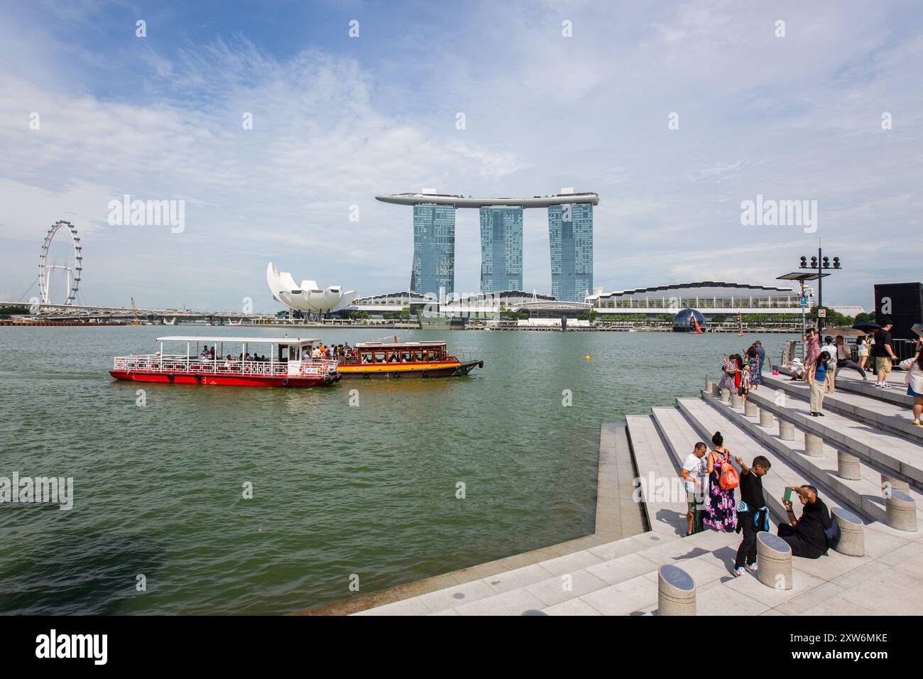 Visitors visiting Merlion Park, opposite Marina Bay Sands, love taking ...