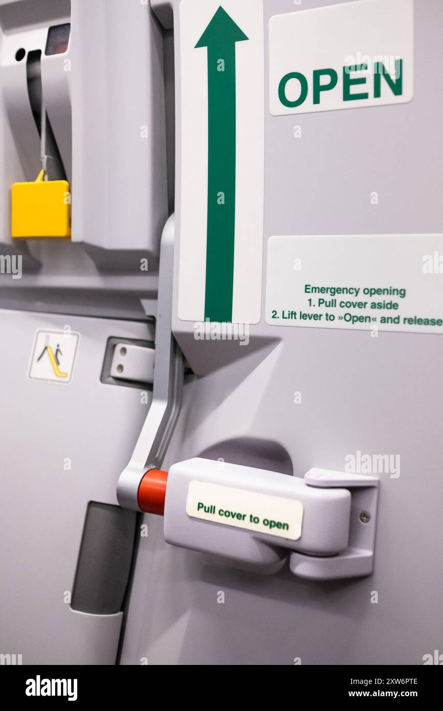 An emergency door in the aircraft cabin. Closed Passenger airplane ...