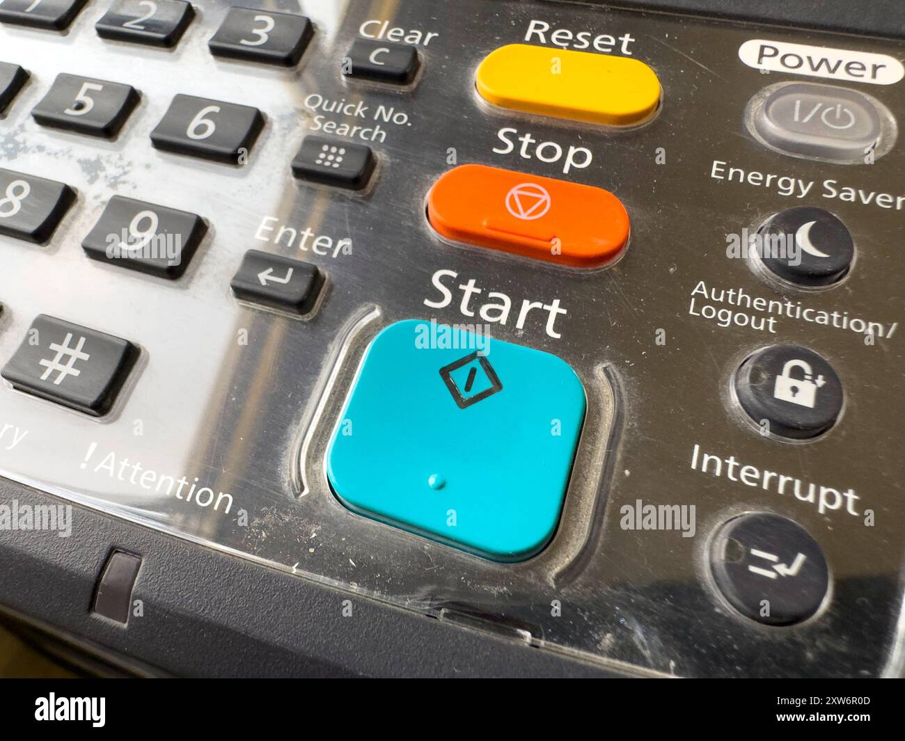 Hand press button on panel of printer, printer scanner laser office ...