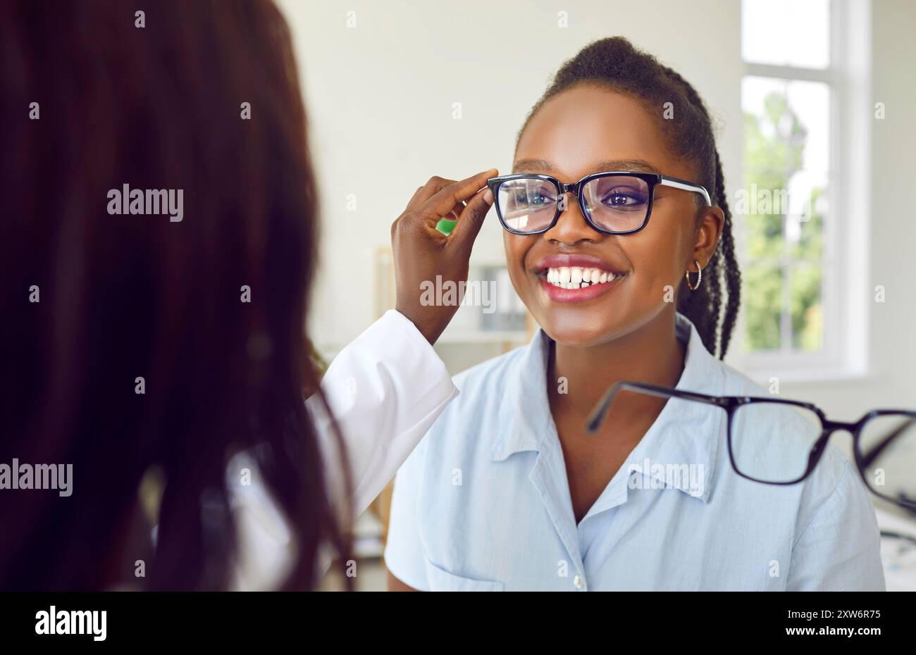 Happy african american oculist hi-res stock photography and images - Alamy