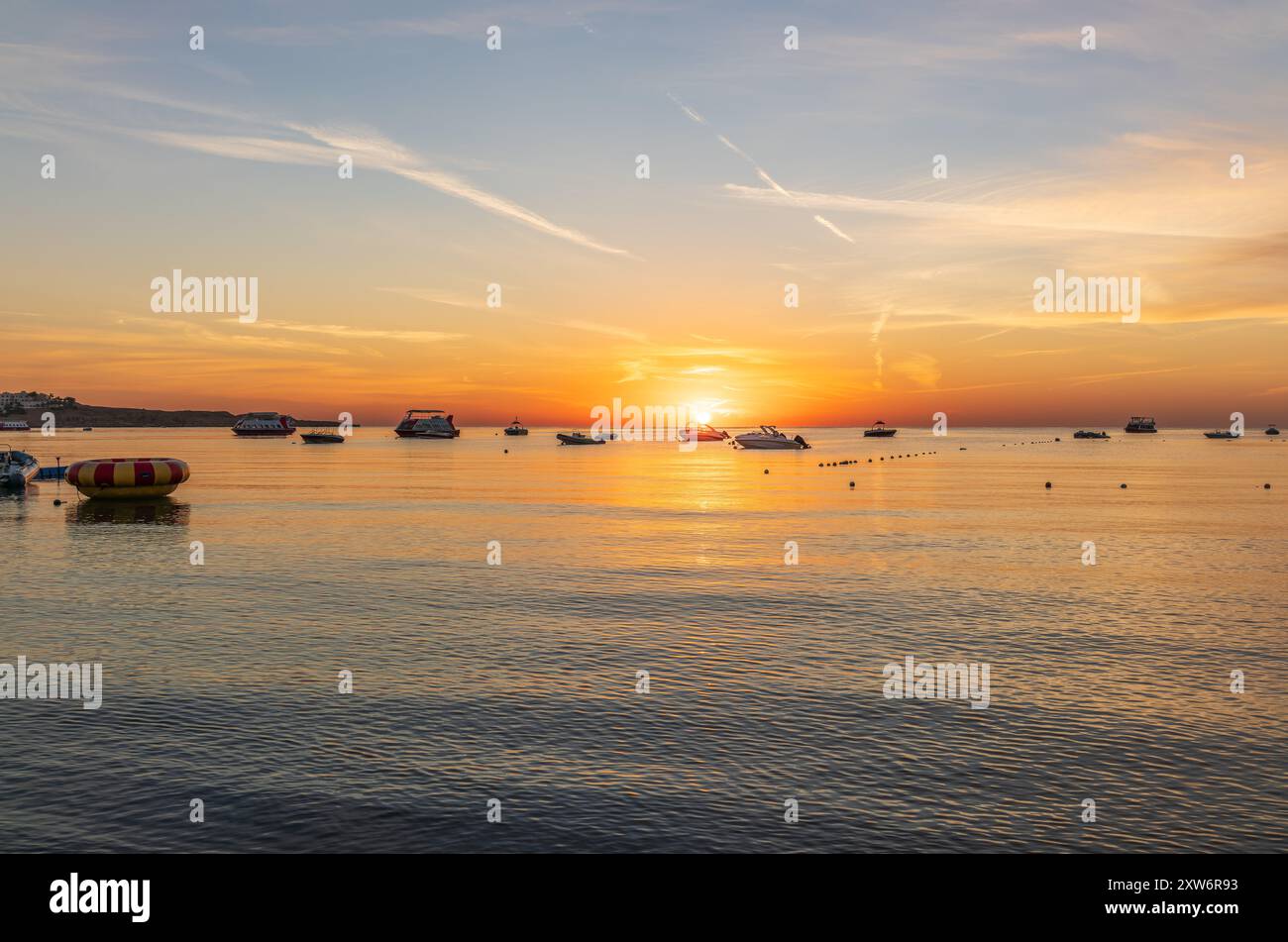 Sunrise over the sea. Panoramic seascape. Burning sky and shining ...