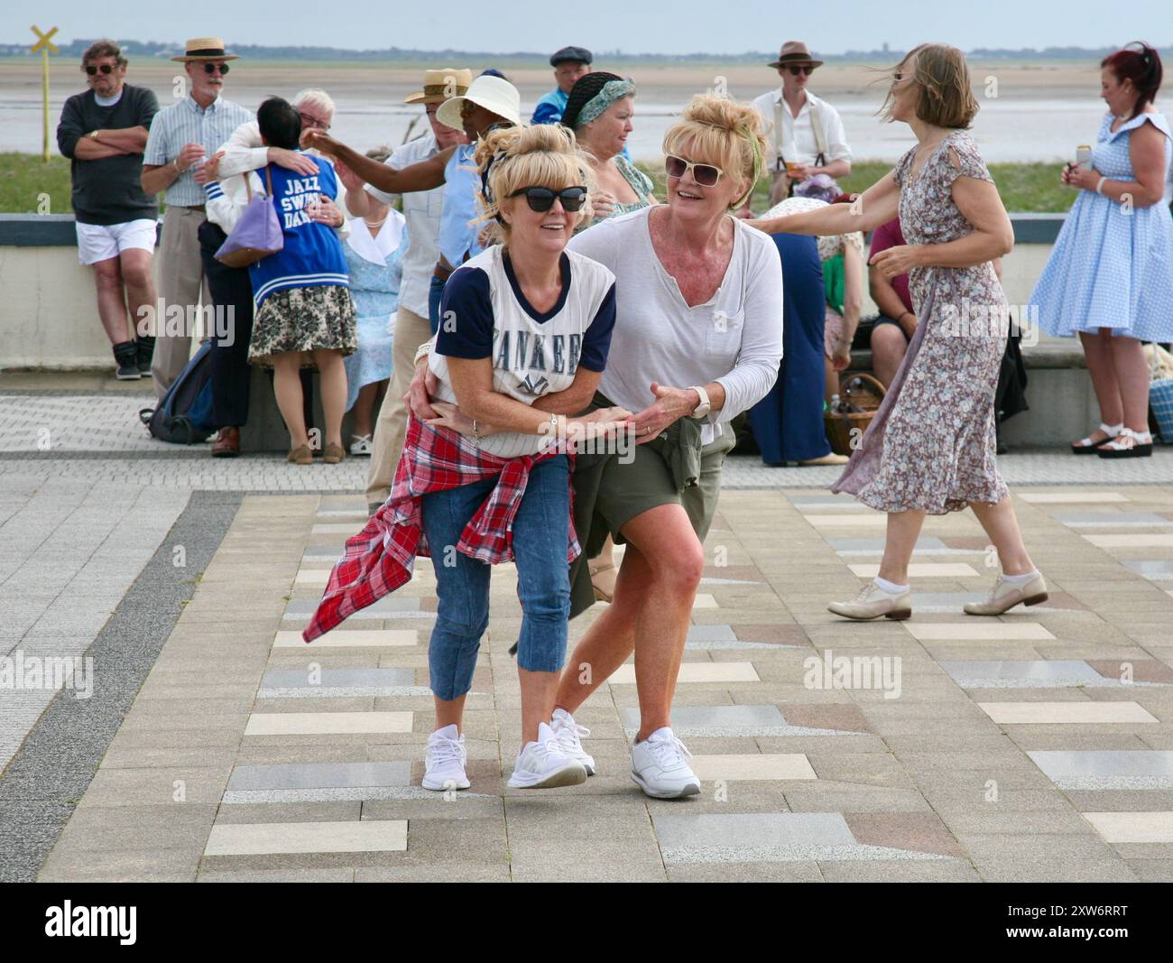 Ladies having lots of fun at the seaside Stock Photo - Alamy