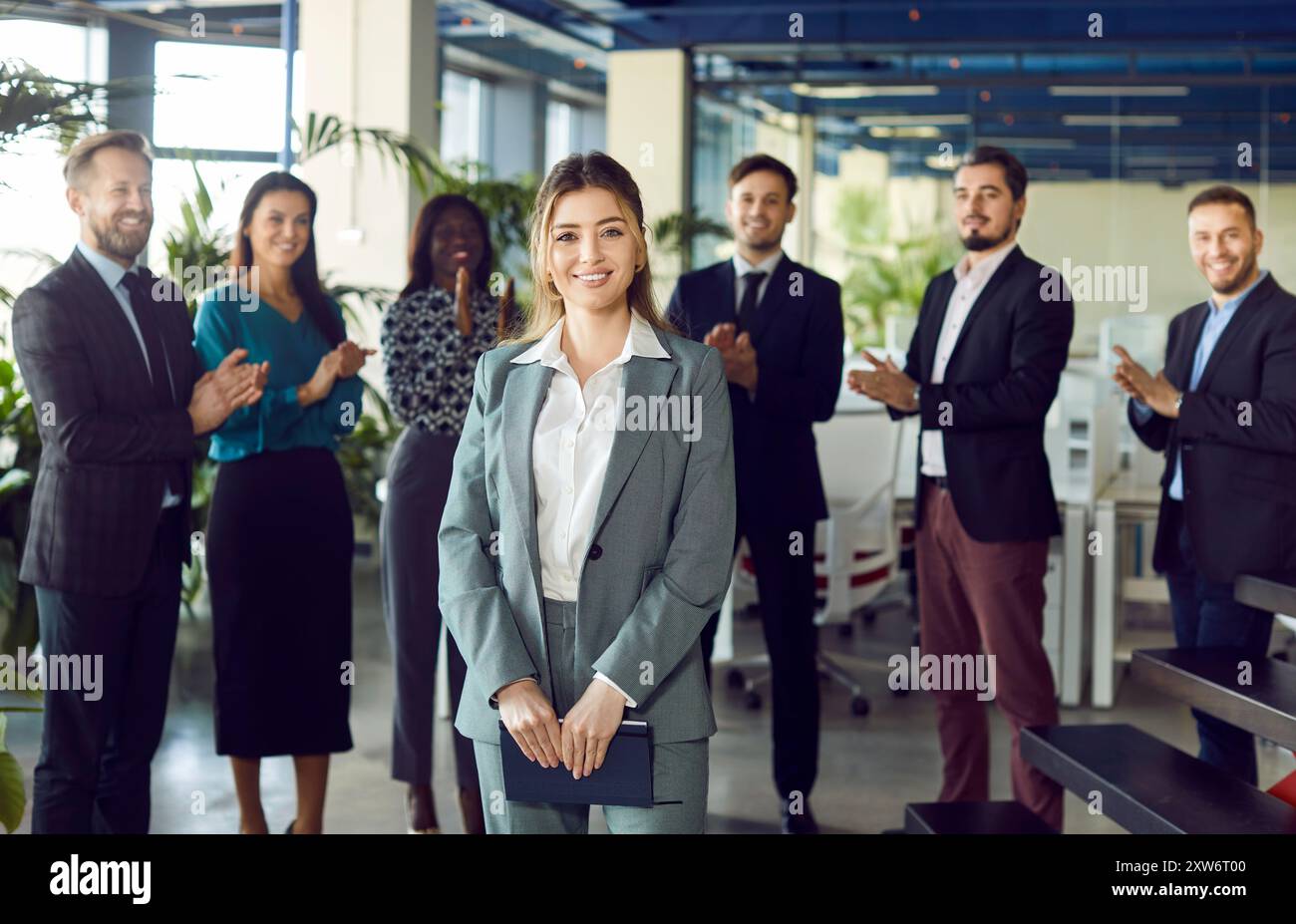 Happy smiling CEO in front of diverse office coworkers, subordinates in ...