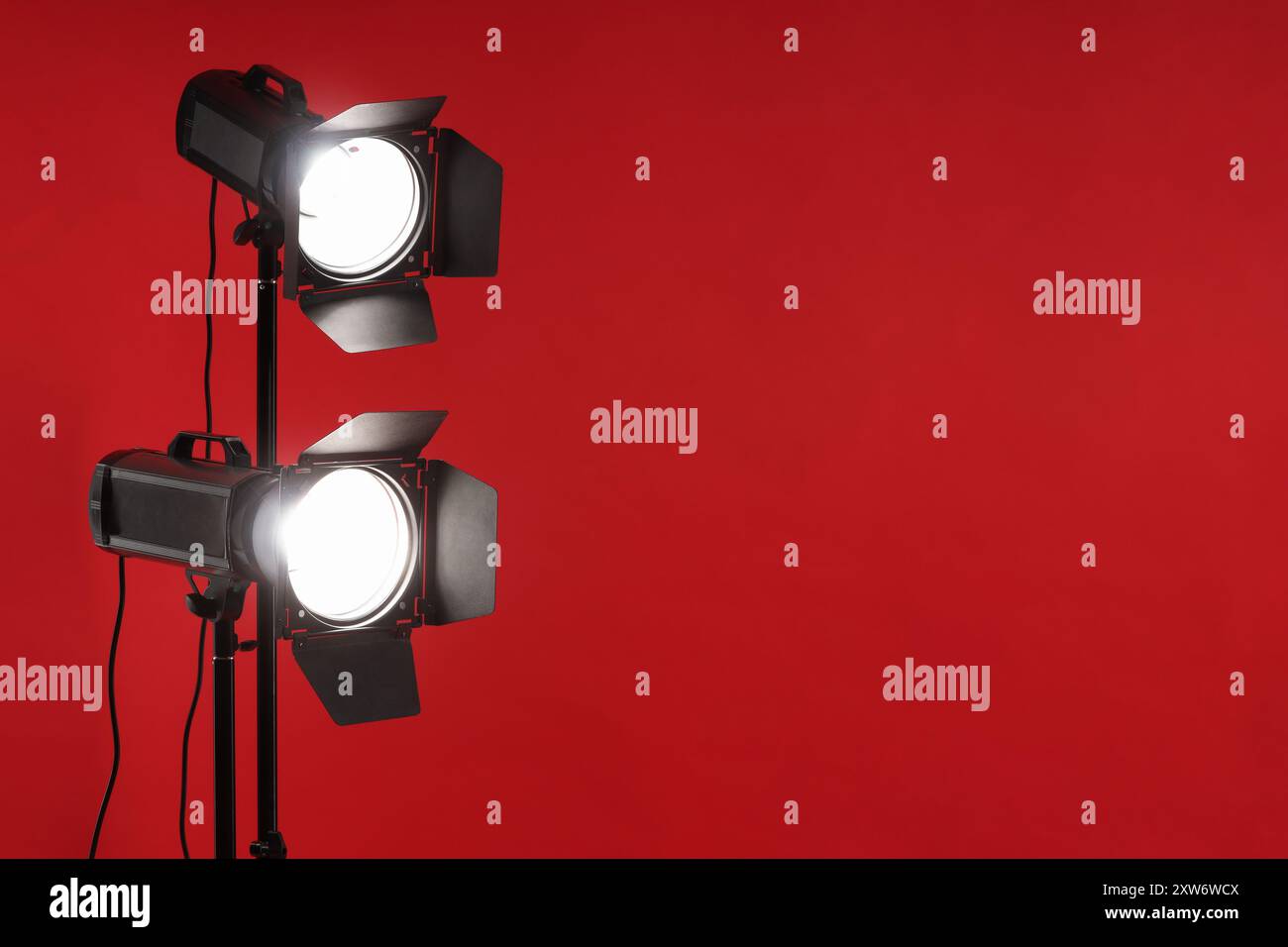 Red photo background and professional lighting equipment in studio ...