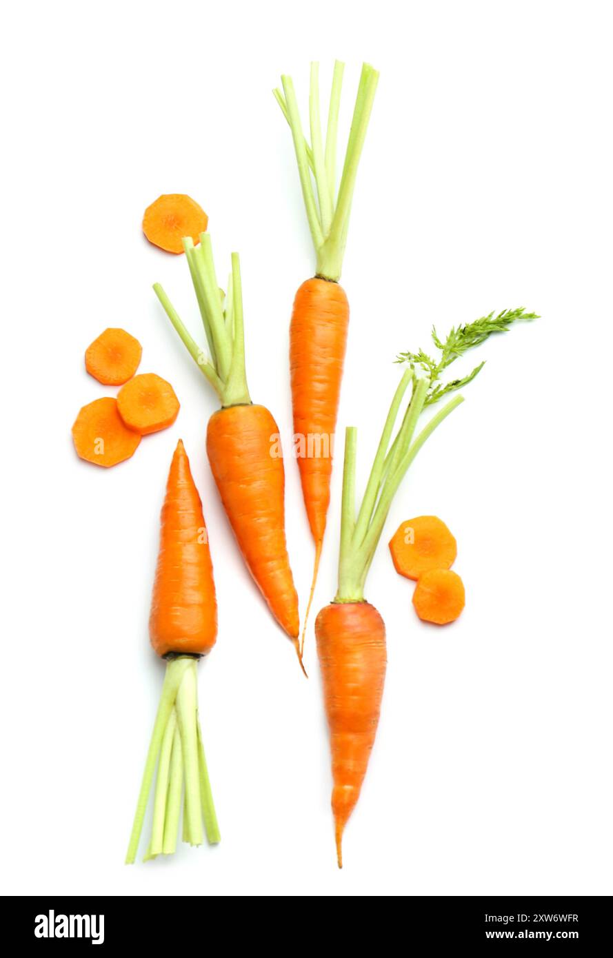 Whole and cut fresh carrots isolated on white, top view Stock Photo - Alamy