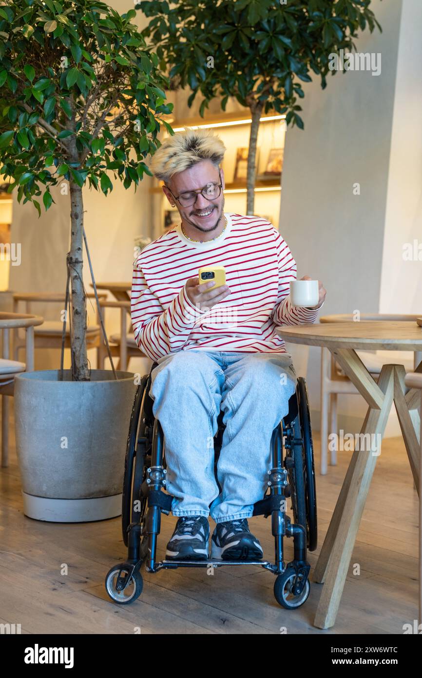 Happy joyful disabled hipster guy smiling chatting on phone enjoy ...