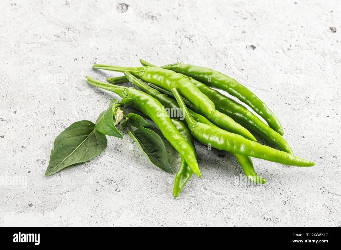 Spicy green chili pepper seasoning heap Stock Photo - Alamy