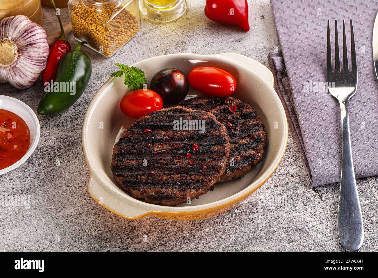 Grilled beef burger cutlet with sauce Stock Photo - Alamy