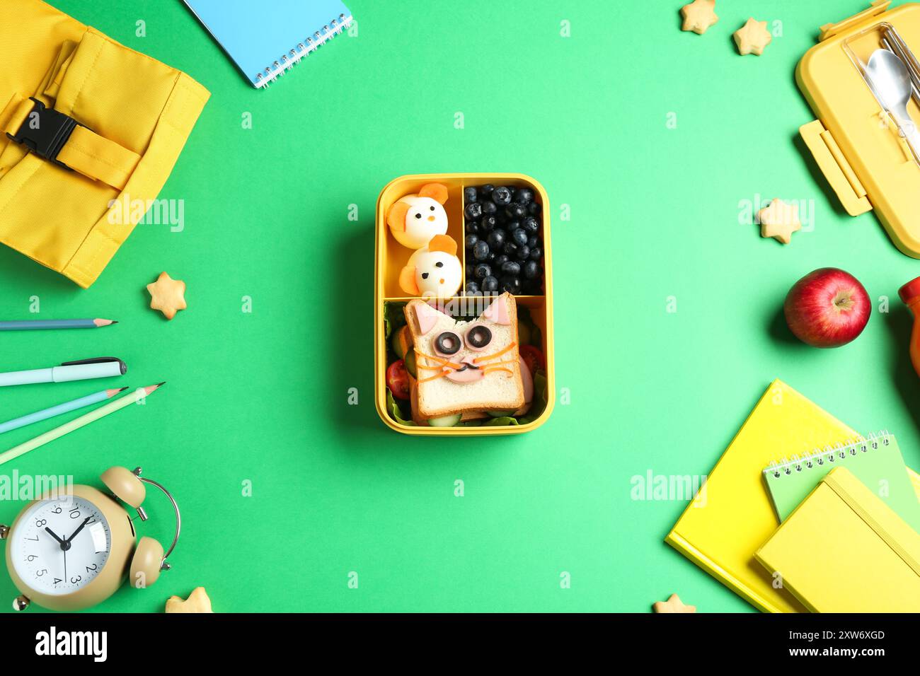 Flat lay composition with lunch box and snacks on green table Stock ...