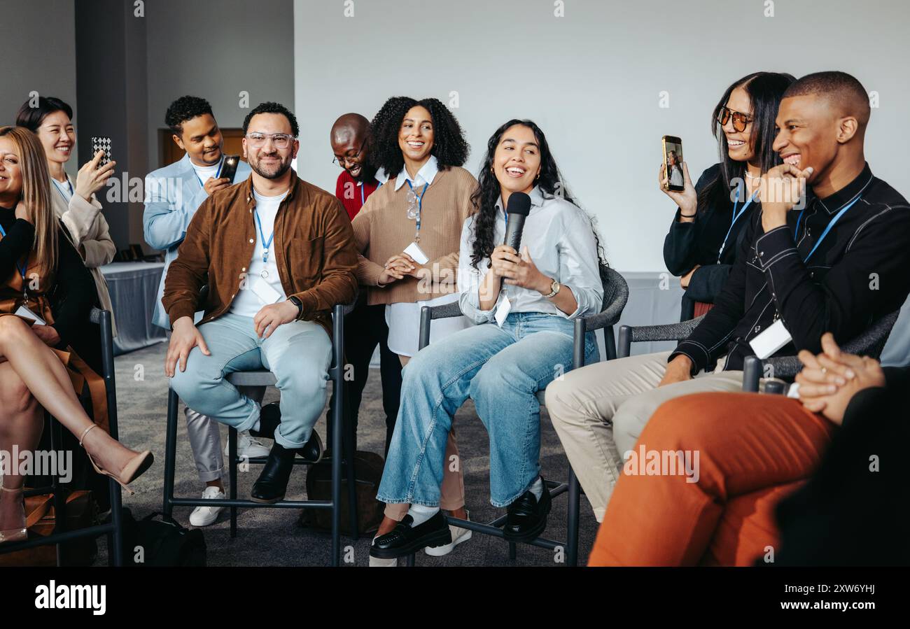 Engaged young entrepreneurs sharing success stories and ideas during a ...