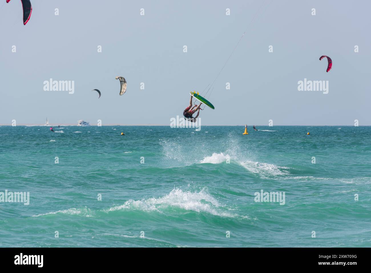 Kitesurfer jumping at Dubai Kite Beach, United Arab Emirates, a popular ...