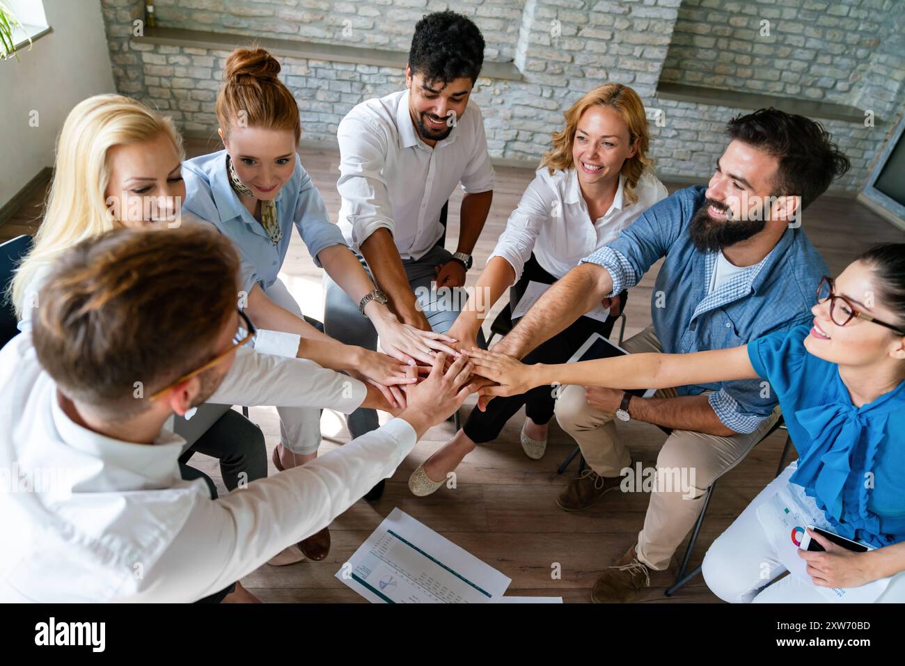 Happy diverse success business team celebrating success and having fun all together Stock Photo ...