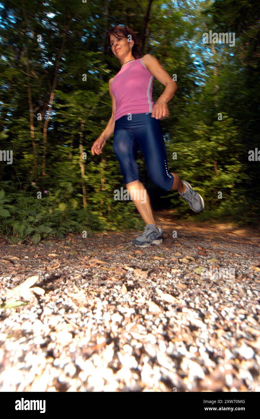 Female athlete runs on asphalt hi-res stock photography and images - Alamy