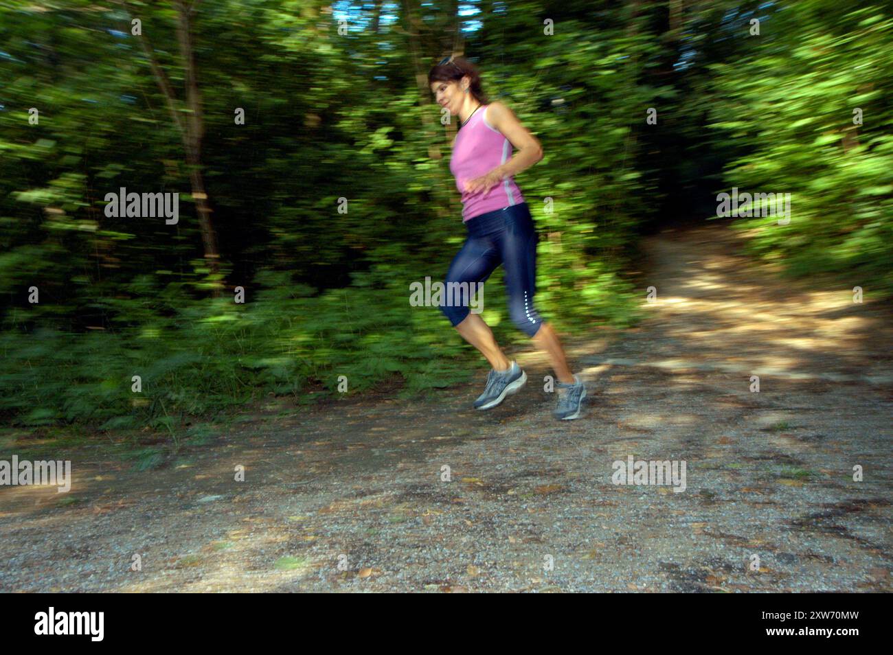 Female athlete runs on asphalt hi-res stock photography and images - Alamy