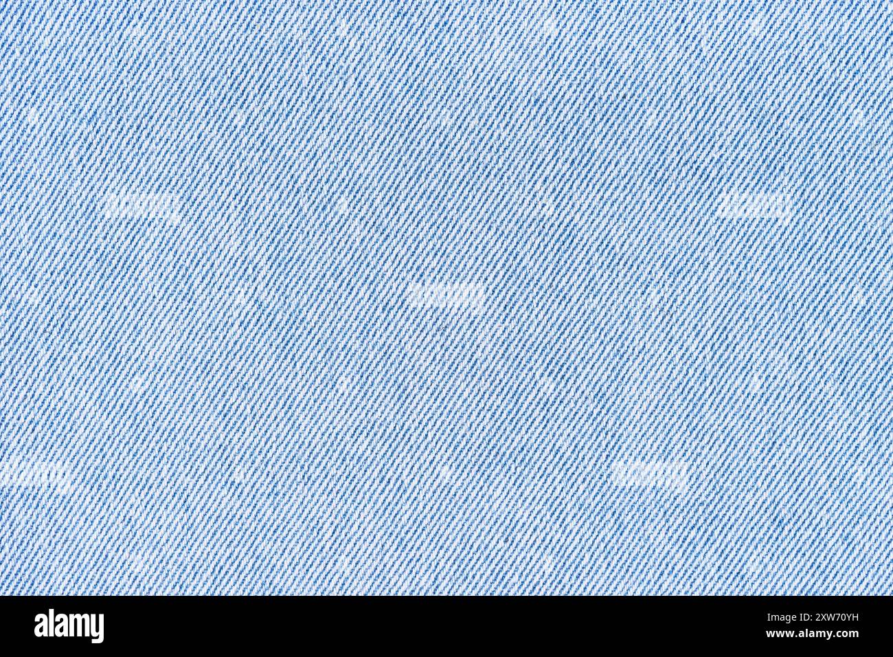 Closeup, macro of blue jeans denim fabric texture background. Diagonal ...