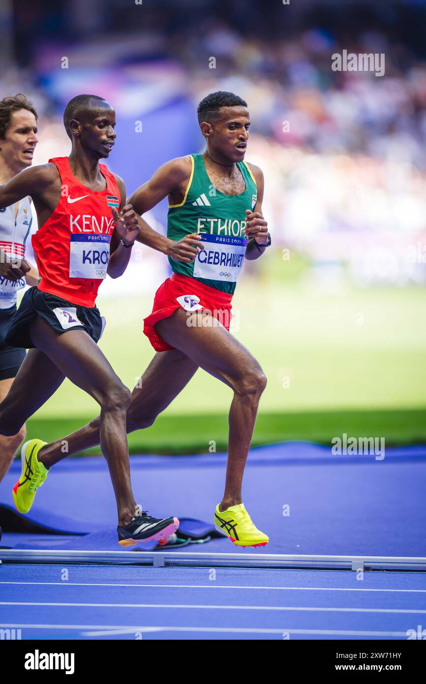 Hagos Gebrhiwet participating in the 5000 meters at the Paris 2024 ...