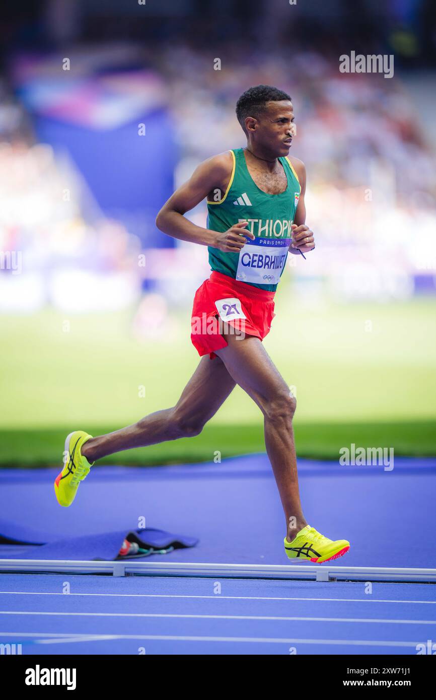 Hagos Gebrhiwet participating in the 5000 meters at the Paris 2024 ...