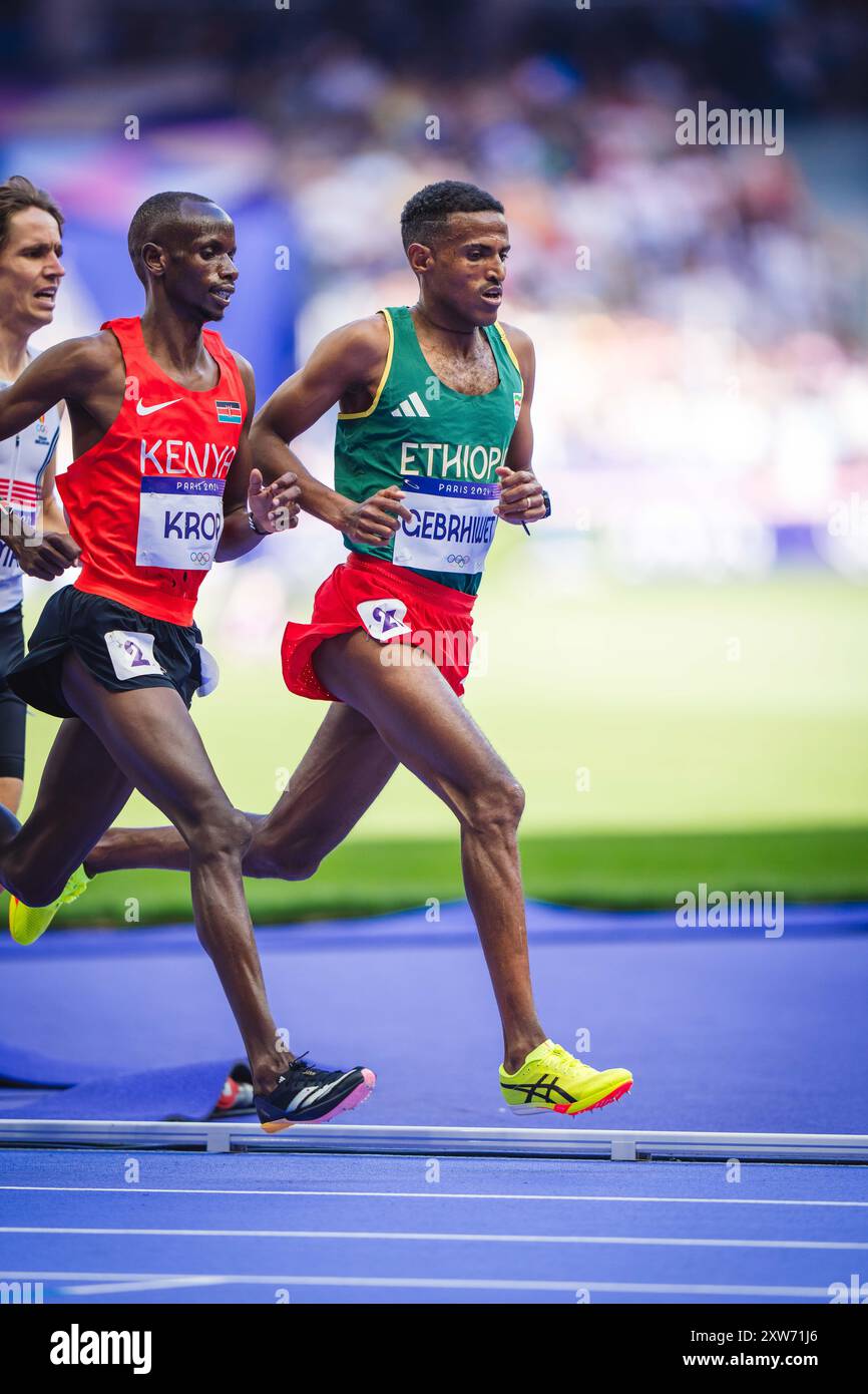 Hagos Gebrhiwet participating in the 5000 meters at the Paris 2024 ...