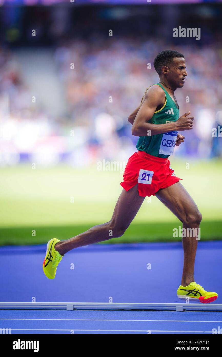 Hagos Gebrhiwet participating in the 5000 meters at the Paris 2024 ...
